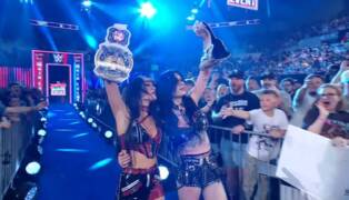 Paige & Brie Bella Defeat The Irresistible Forces to Retain Women's Tag ...